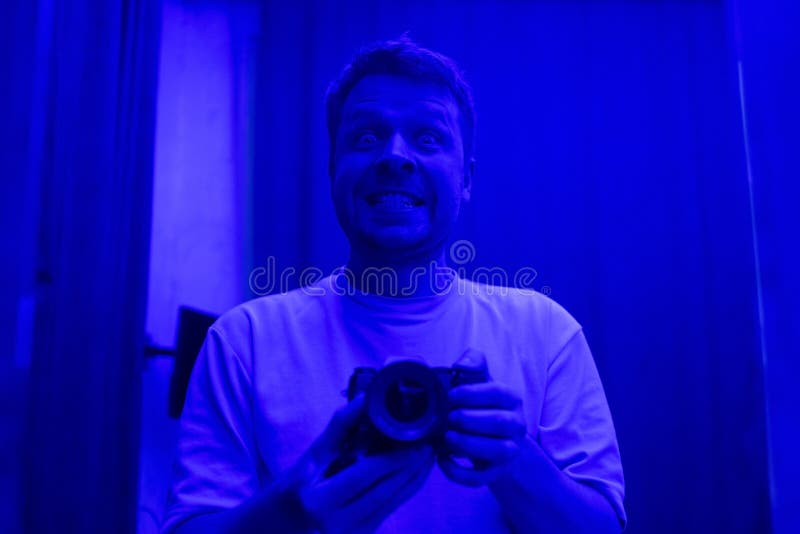 Man Making Selfie in Strange Blue Light. Stock Image - Image of casual ...