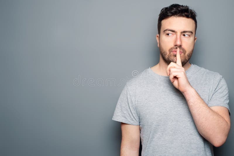 Serious Man with Silence Symbol, Studio Portrait Stock Photo - Image of ...