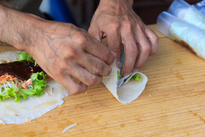 Man making spring rolls stock image. Image of spring - 29981801