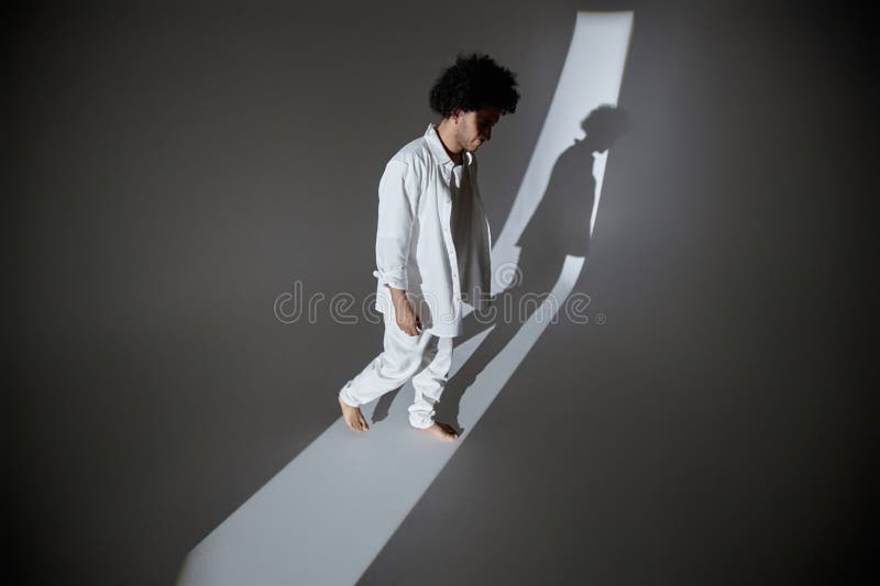 Man Making Step into Light from Darkness Stock Photo - Image of ...