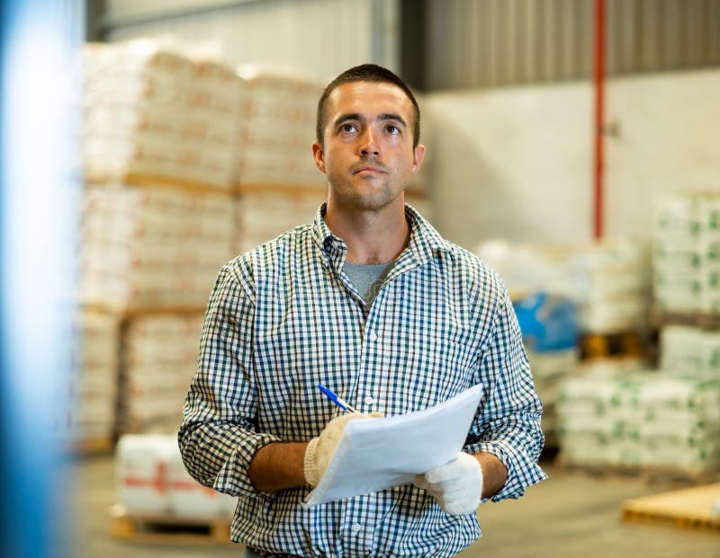 Man Making Stock Control in Warehouse Stock Photo - Image of storage ...