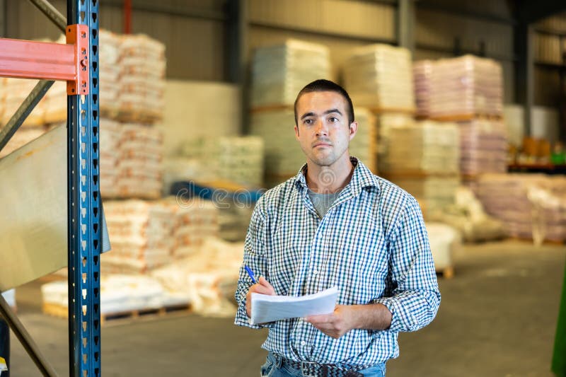 Man Making Stock Control in Warehouse Stock Photo - Image of document ...