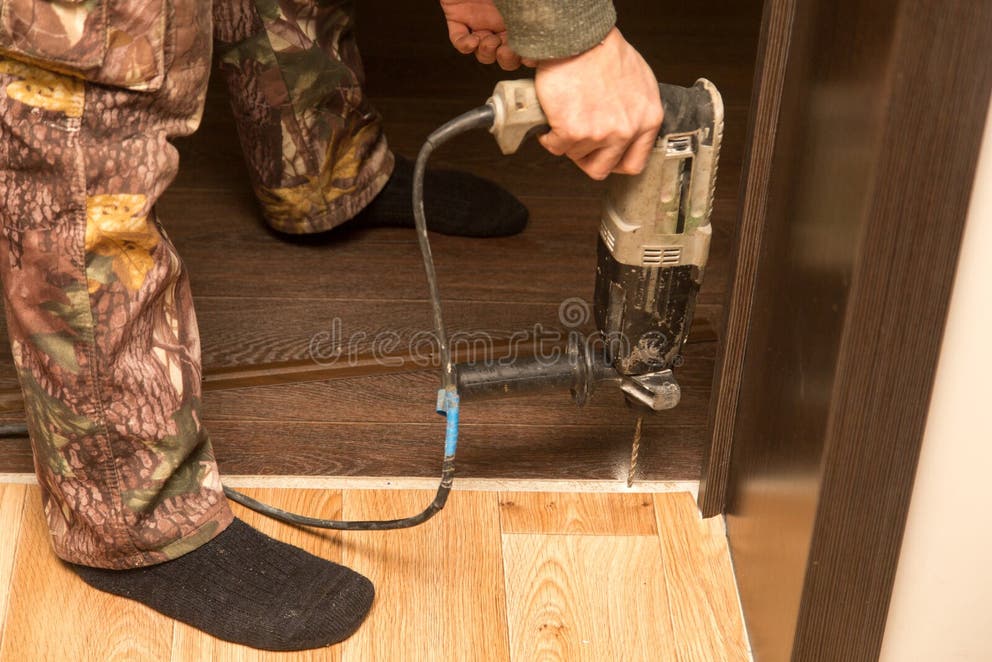A Man is Making a Threshold on the Floor Stock Photo - Image of white ...