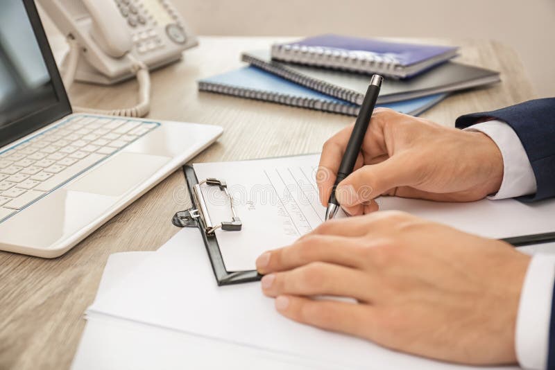 Man Making To-do List while Sitting at Table, Closeup Stock Photo ...