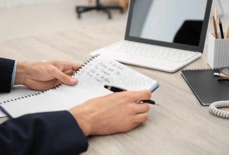Man Making To-do List while Sitting at Table, Closeup Stock Photo ...