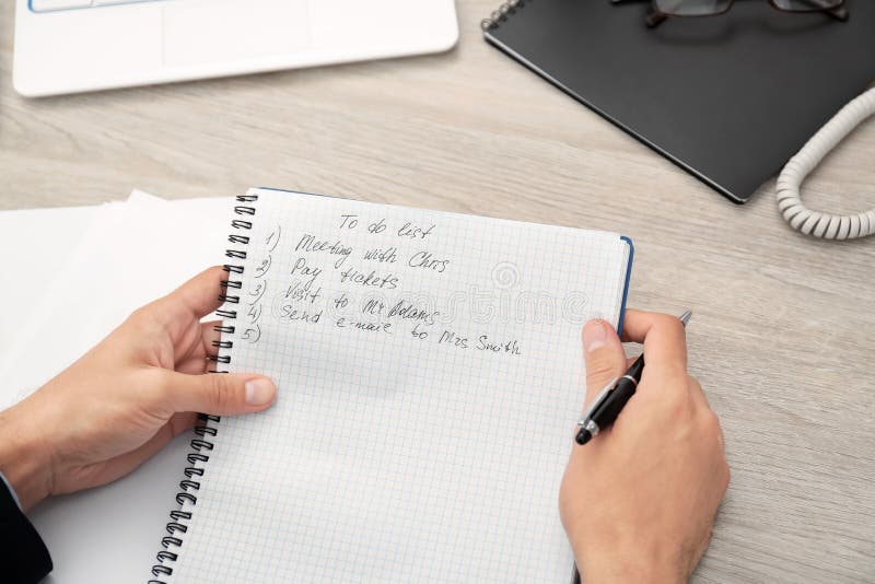 Man Making To-do List while Sitting at Table, Closeup Stock Photo ...