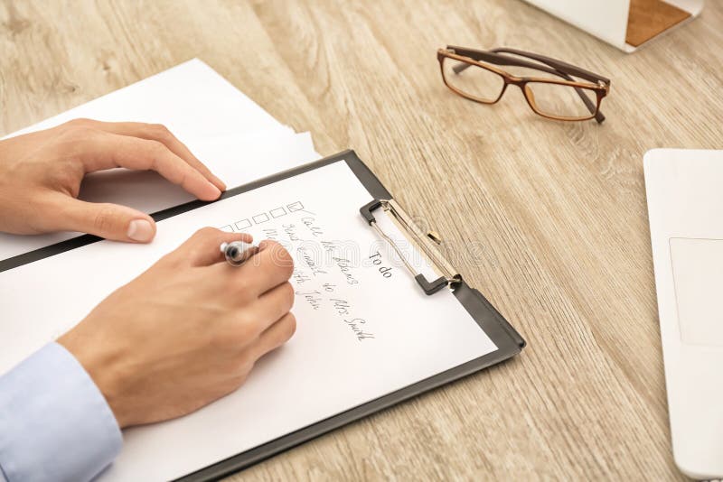 Man Making To-do List while Sitting at Table, Closeup Stock Photo ...