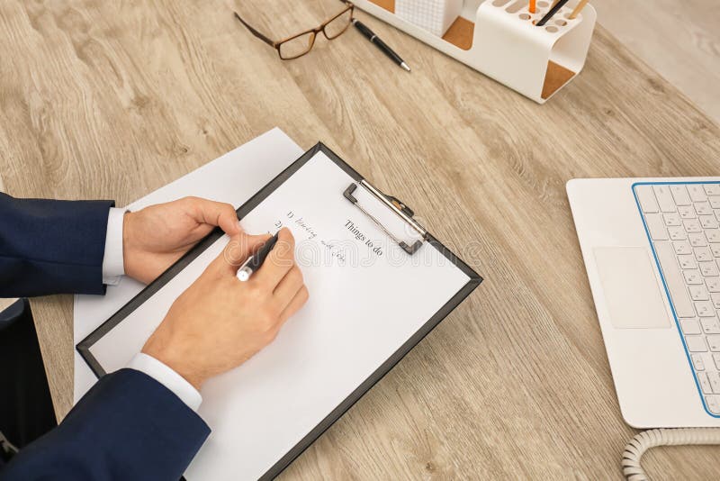 Man Making To-do List while Sitting at Table Stock Image - Image of ...