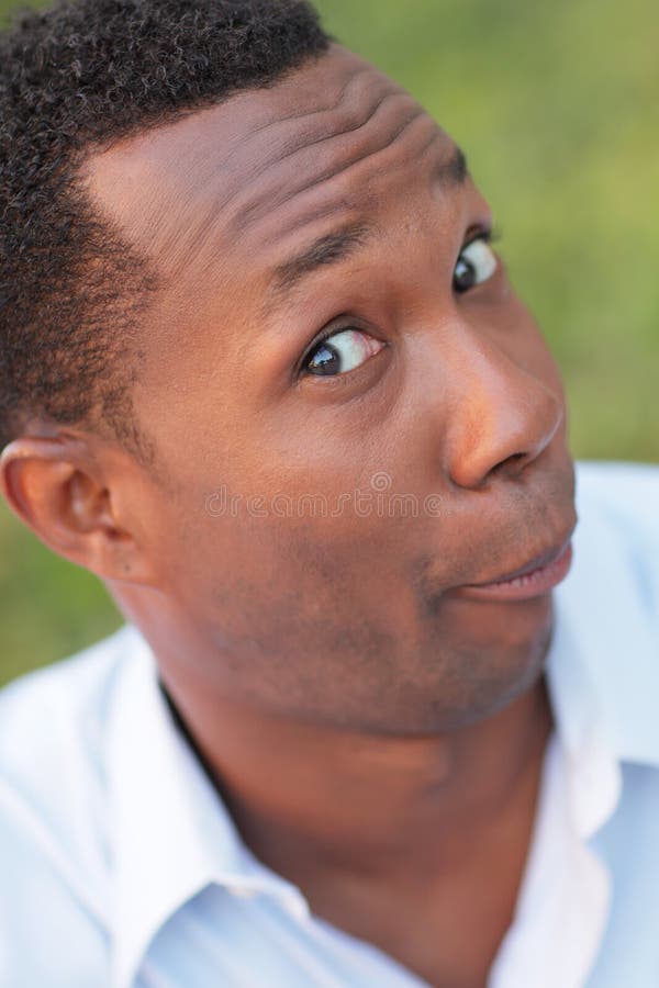 Man making an unusual face stock photo. Image of shirt - 18059976