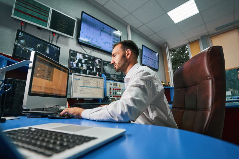 Man Managing Network of Data Center from Computer Stock Photo - Image ...