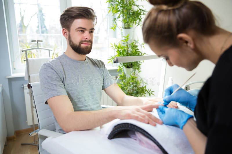 Man during manicure stock image. Image of male, pampering - 91460969