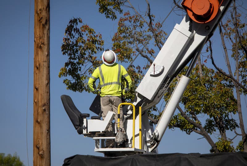 A Man on a Manlift Looking Up To Check on Work in Progress Stock Image ...
