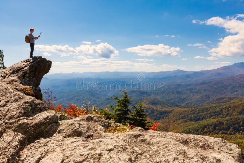 Man Overlooking the Mountains Belown Stock Photo - Image of filtered ...