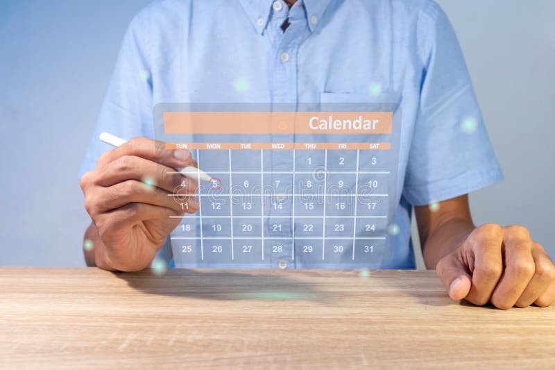 A Man Marking Dates on Virtual Calendar. Highlight Appointment ...