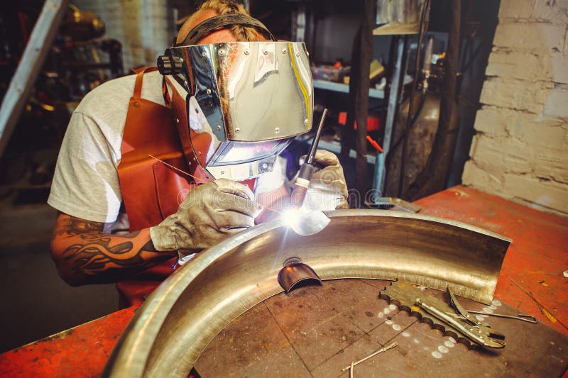 The Man in the Mask Brews Beautiful Welds with Argon-arc Welding Stock ...