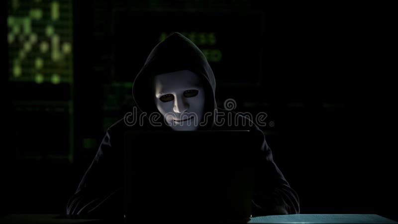 Man in Mask Cracking Codes on Laptop, Falsification in Elections, Vote ...