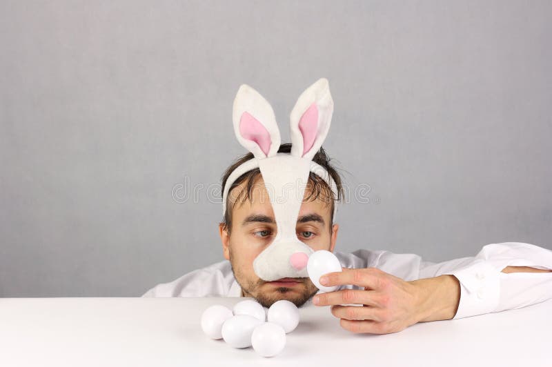 Man in the Mask Easter Rabbit Looking at the Egg Stock Photo - Image of ...
