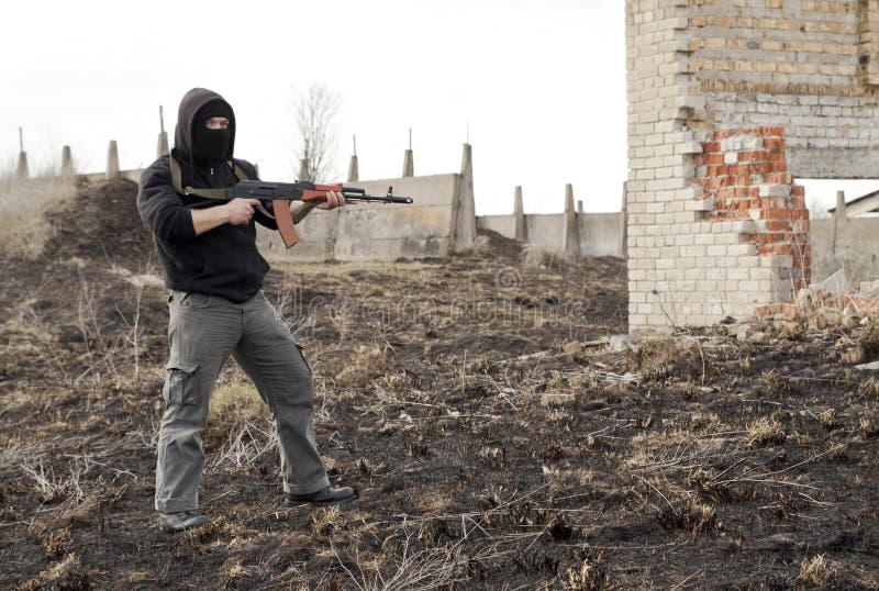 Man in mask with gun stock photo. Image of firefight - 24719576