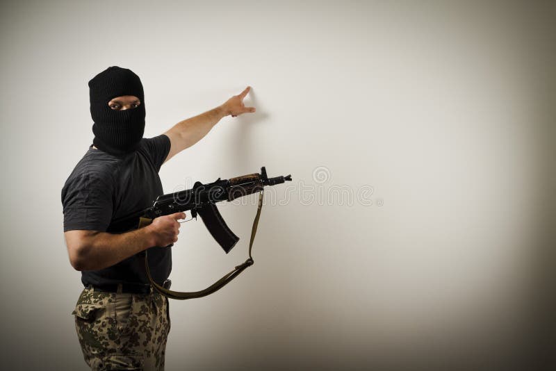 Man in mask with gun stock photo. Image of escape, draw - 45103268