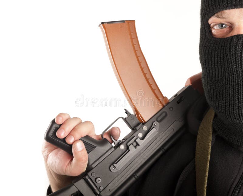Man in mask with gun stock photo. Image of crime, cruel - 24919258