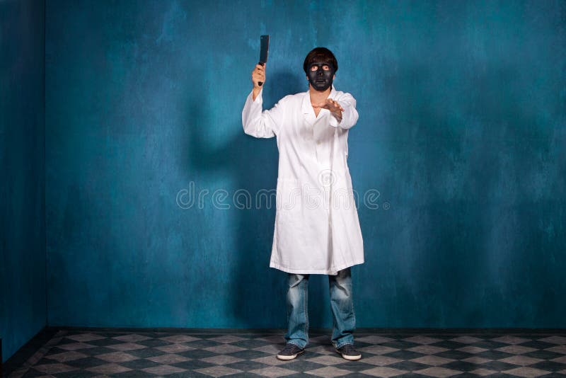 Man with mask and knife stock photo. Image of chopper - 26462644