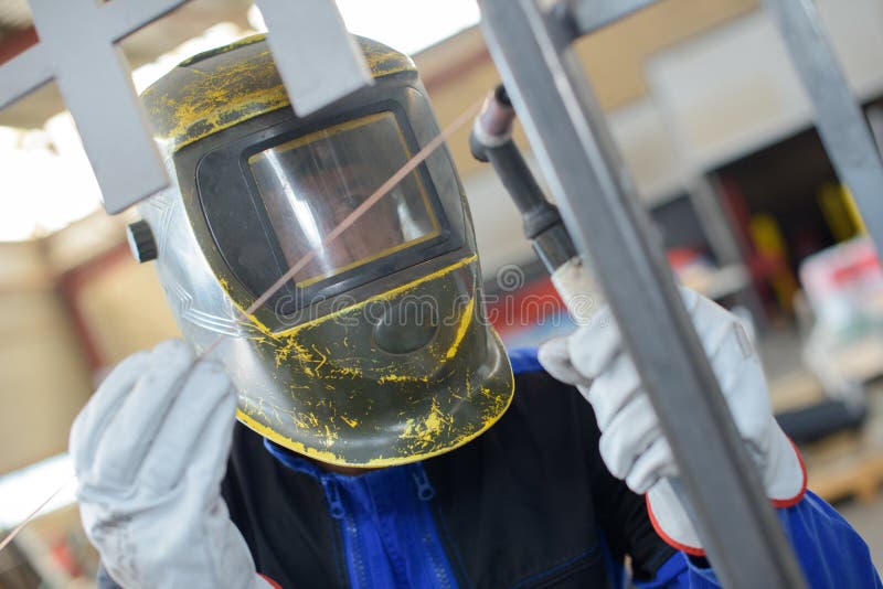 Man in mask welding stock image. Image of construction - 115614091
