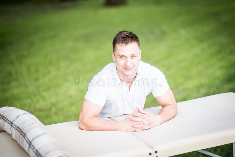 Man with Massage Table Outside, Stock Photo - Image of interior ...