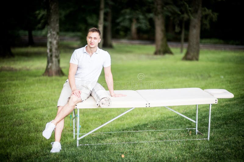 Man Sit on the Massage Table Outside Stock Image - Image of caucasian ...