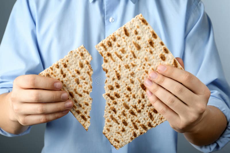 Man with Matzo on Grey Background. Pesach Passover Celebration Stock ...