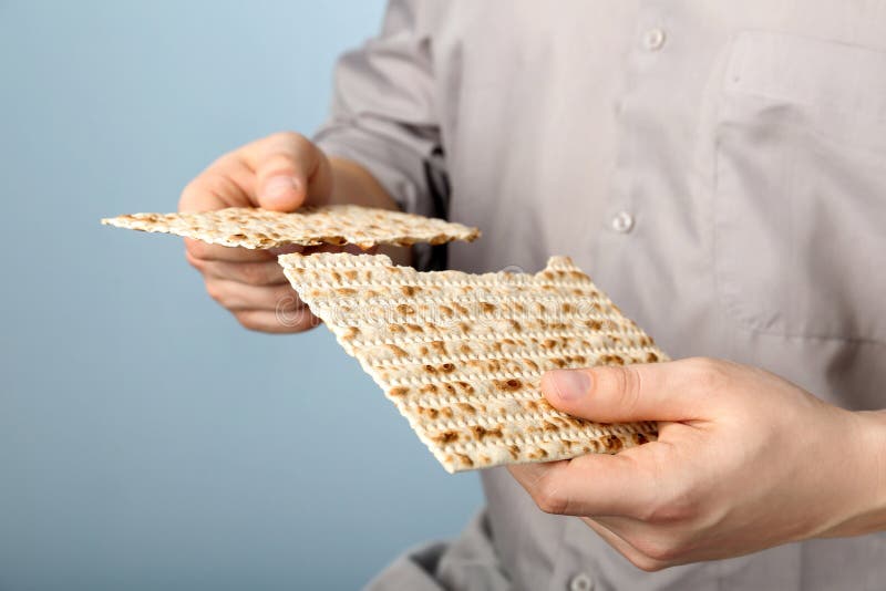 Man with Matzo on Grey Background. Pesach Passover Celebration Stock ...