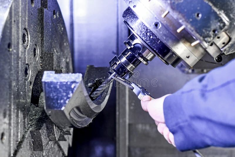 A Man Measures a Part with a Vernier Caliper on a CNC Milling Machine ...