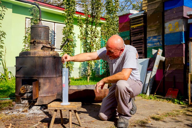 Man Measures Strength of Alcohol by Determining the Amount of Alcohol ...