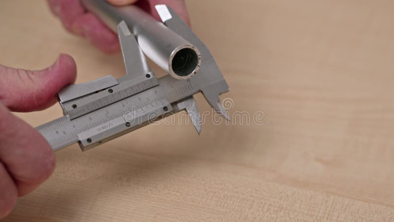 Man Measuring Aluminum Pipe with Calipers. Stock Video - Video of ...
