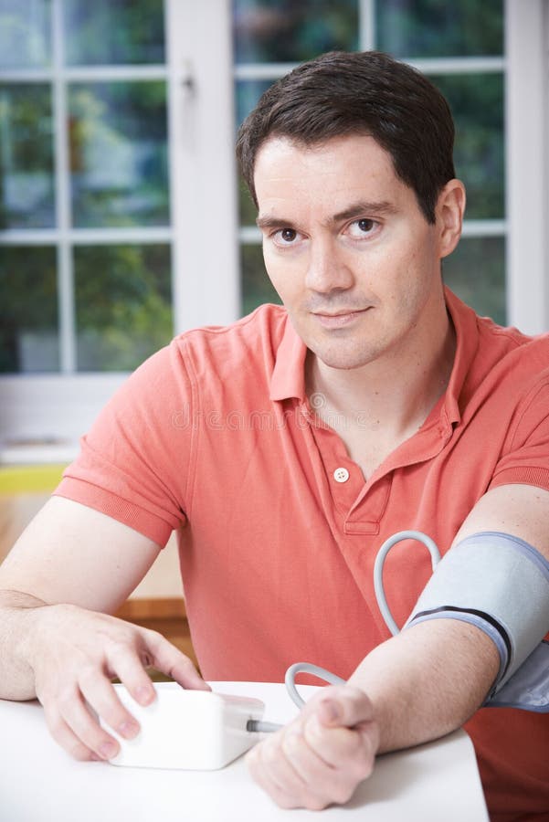 Man Measuring Blood Pressure at Home Stock Image - Image of information ...