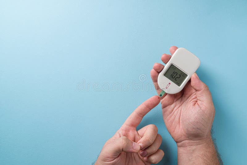 Man Measuring Blood Sugar Level with a Glucometer. Diabetes Concept on ...