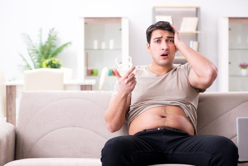 The Man Measuring Body Fat with Calipers Stock Photo - Image of fatness ...