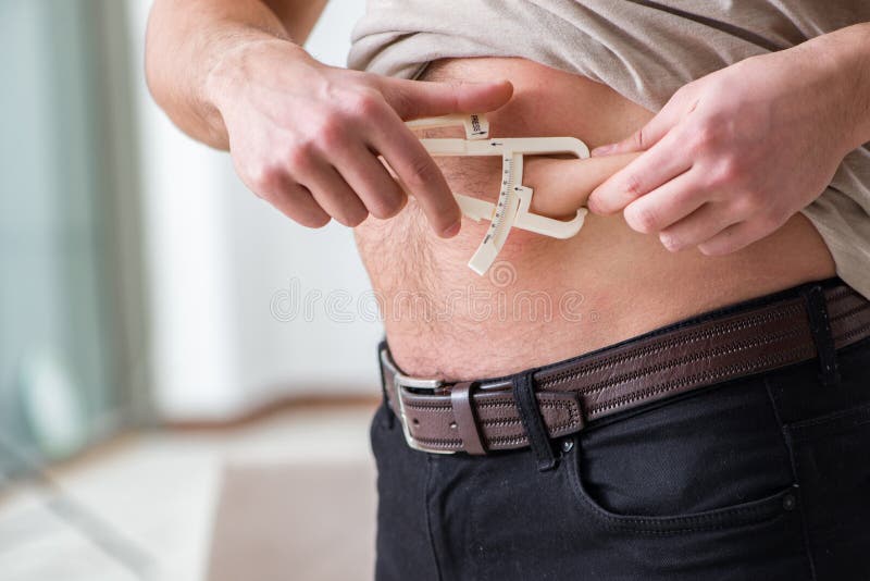 The Man Measuring Body Fat with Calipers Stock Image - Image of obesity ...