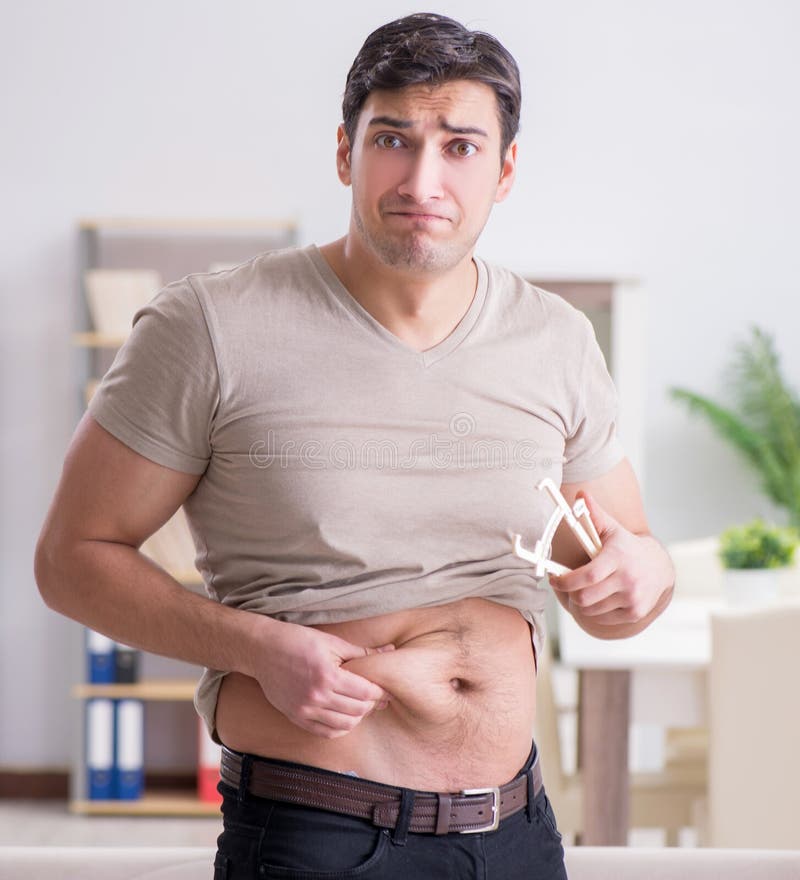 Man Measuring Body Fat with Calipers Stock Photo - Image of diet ...