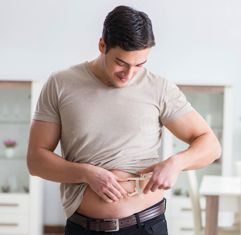 Man Measuring Body Fat with Calipers Stock Image - Image of metabolism ...