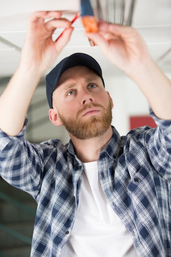 Man Measuring Ceiling with Construction Level Stock Image - Image of ...