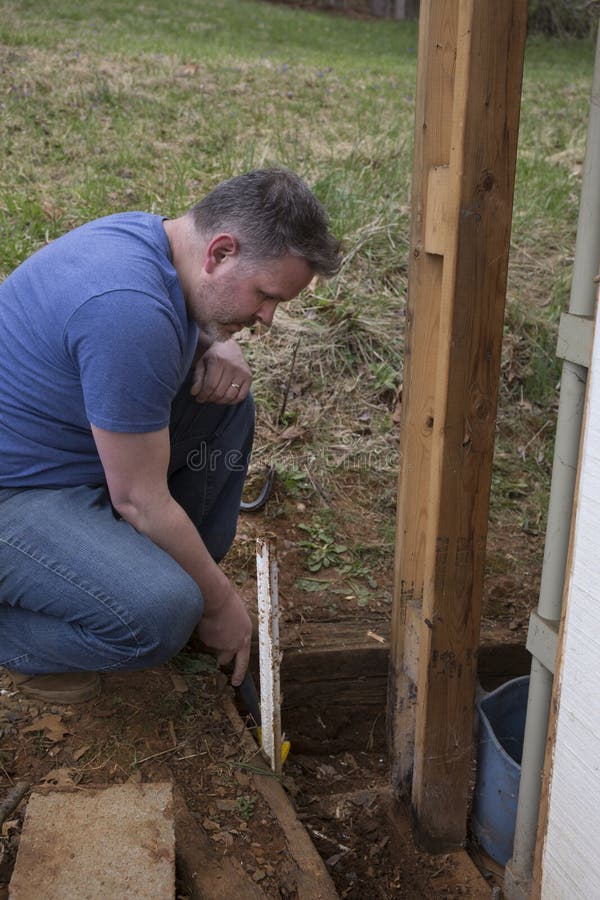 Man Measuring at Construction Site Stock Photo - Image of repairman ...