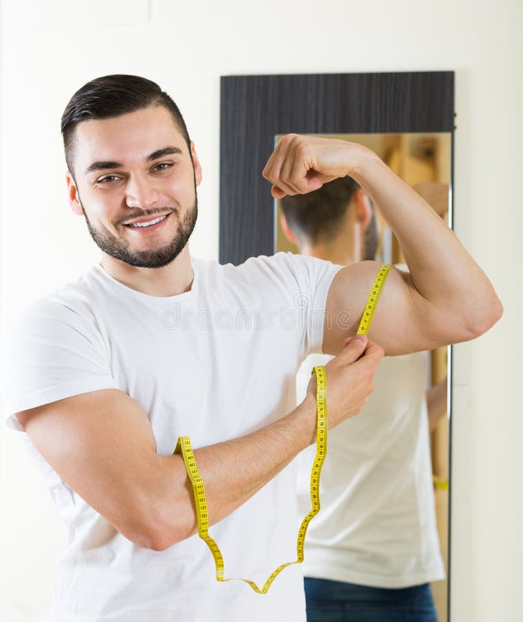 Handsome Guy Measuring His Biceps Stock Photos - Free & Royalty-Free ...