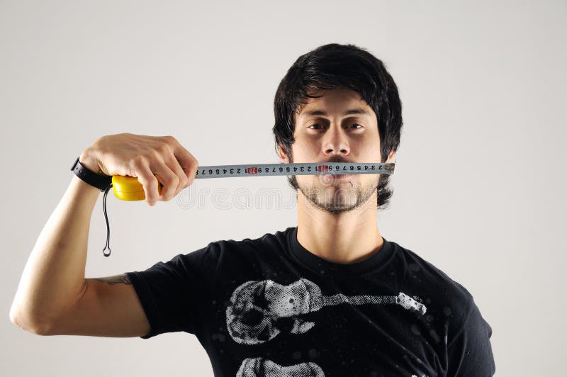 Man measuring his face stock photo. Image of inches, composition - 8809518