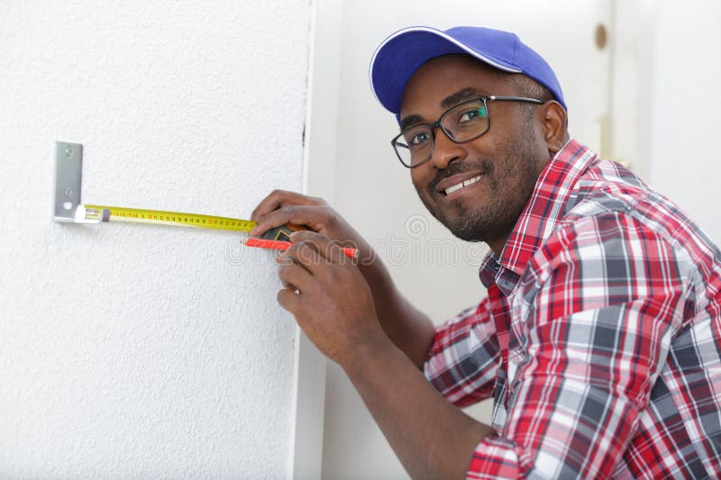 Man Measuring Wall and Mark with Pen Stock Image - Image of ...