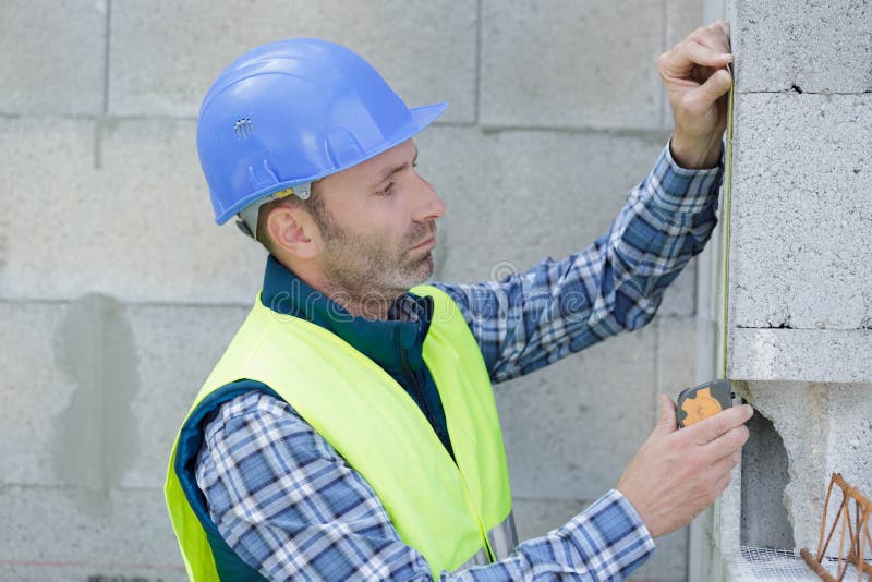 Man Measuring Wall by Meter Stock Image - Image of protective, meter ...