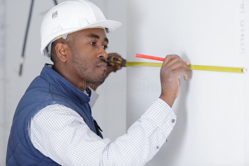 Man Measuring Wall Using Folding Ruler Stock Image - Image of measure ...