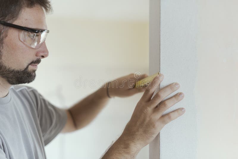 Man Measuring a Wall Using a Folding Ruler Stock Photo - Image of home ...