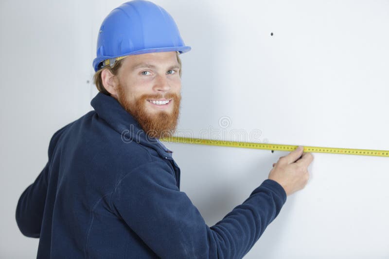 Man Measuring Wall Using Ruler Stock Image - Image of manual, hand ...