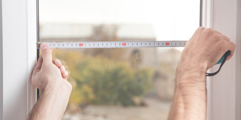 Man Measuring Window. Installing New Window in House Stock Photo ...
