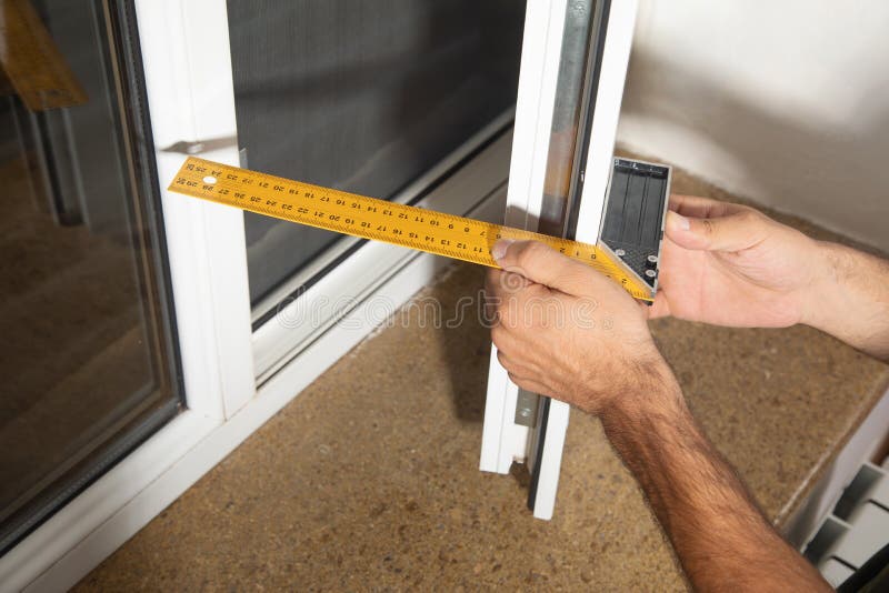 Man Measuring Window. Installing New Window in House Stock Photo ...